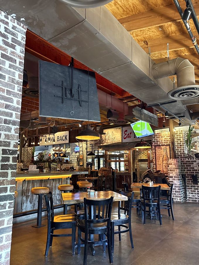 Industrial meets cozy in this thoughtfully designed interior. The "Y'all Come Back" sign isn't just decoration&mdash;it's a prediction.