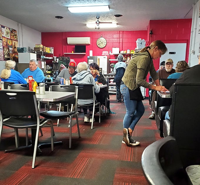 Where magic happens: The vibrant red walls and bustling interior create that perfect diner atmosphere where strangers become neighbors and calories don't count.