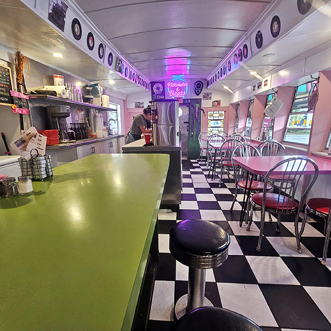 Step inside and time stands still – the classic checkerboard floor, green counter, and vintage decor transport you to an era when conversation flowed as freely as the coffee.