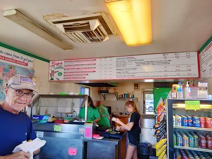 Inside Luigi's, time stands still. The no-frills counter and vintage menu board promise sandwich salvation rather than Instagram aesthetics.