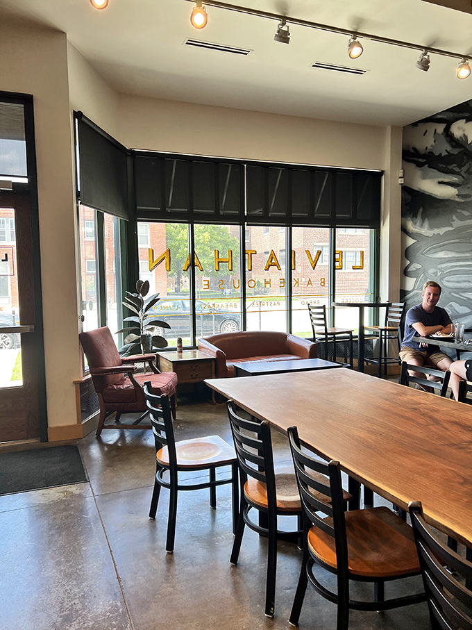 Industrial chic meets cozy comfort in this thoughtfully designed space where the communal table invites both conversation and contemplation.