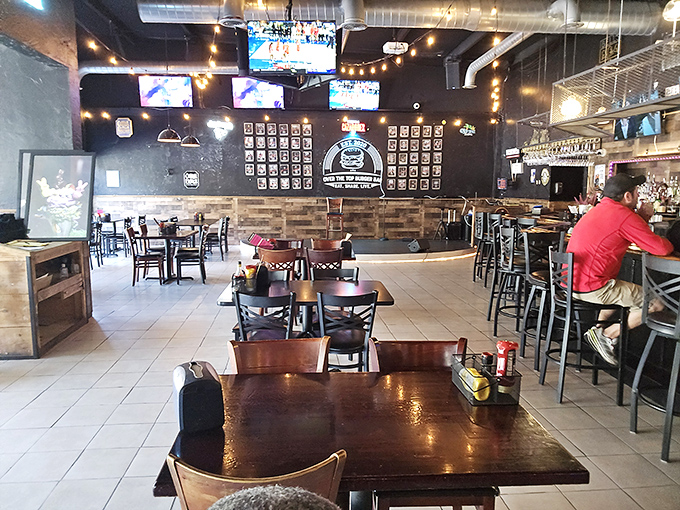Industrial-chic meets comfort at Over The Top's dining room. The exposed ductwork and string lights create the perfect backdrop for the food drama about to unfold.
