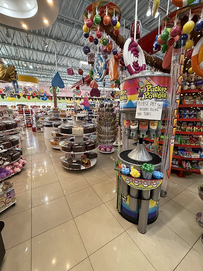 Sugar-coated heaven awaits inside, where giant candy decorations hang from the ceiling like the sweetest chandelier you've ever seen.