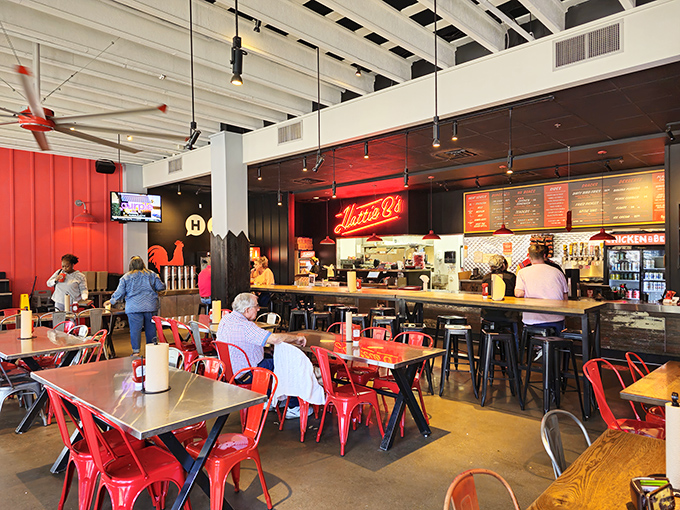 Industrial-chic meets Southern comfort inside Hattie B's, where red metal chairs invite you to sit a spell and prepare for flavor warfare.