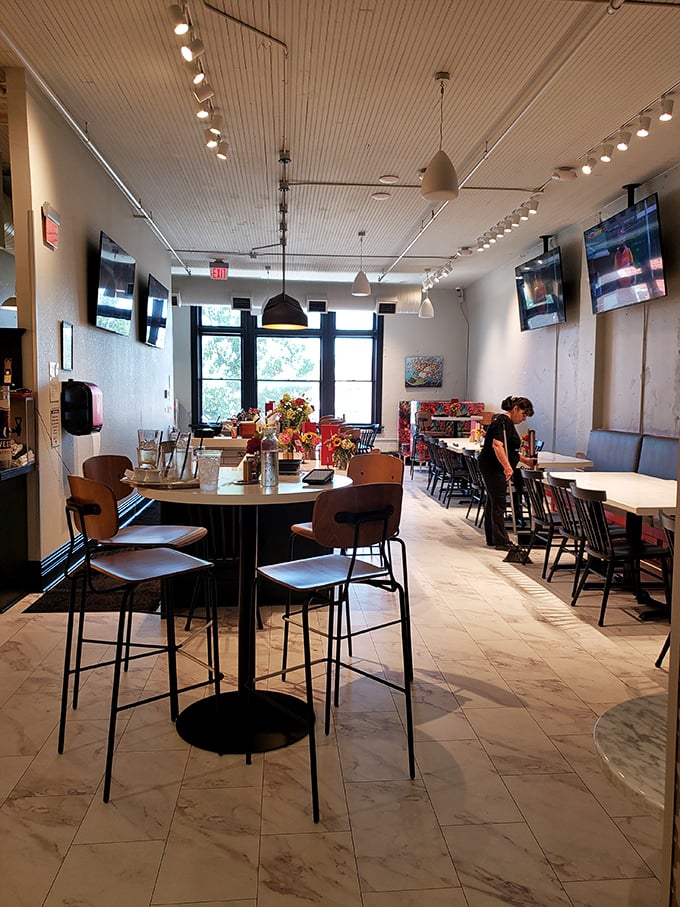 Clean lines, modern lighting, and comfortable seating create an atmosphere that says "stay awhile" without saying a word.