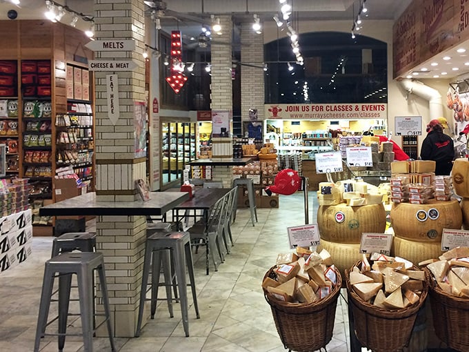 Inside Murray's, wheels of cheese command attention like fine art in a gallery, while industrial-chic seating invites visitors to linger in this cathedral of cultured milk.