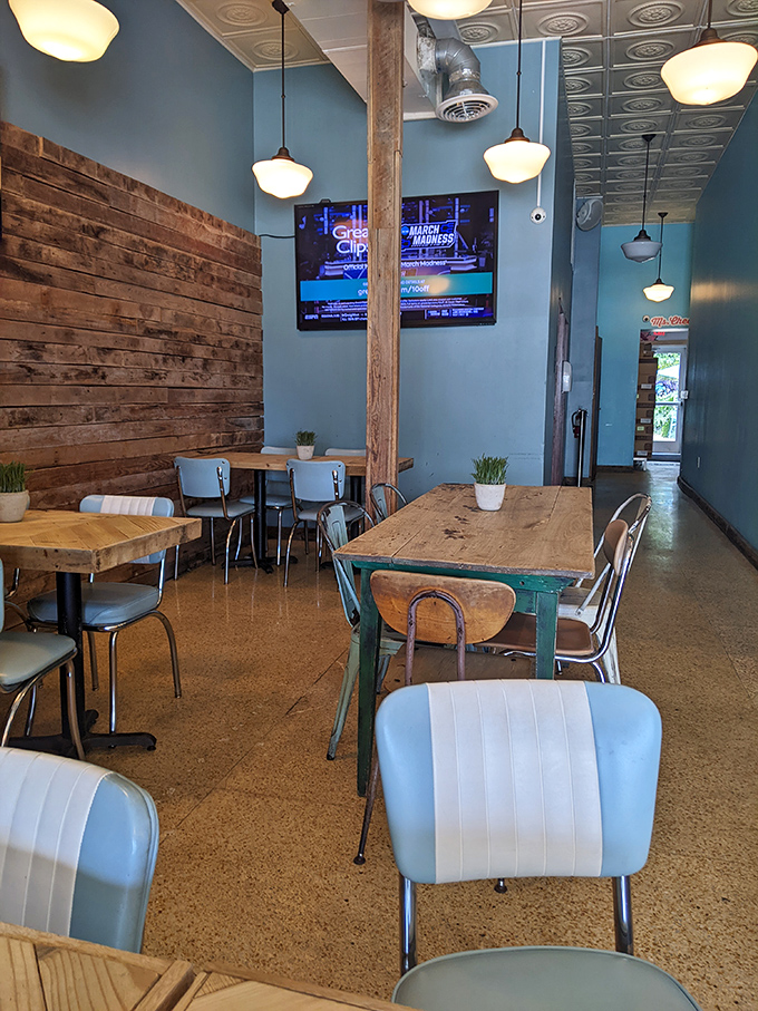 Inside, reclaimed wood meets mid-century modern furnishings, creating the perfect backdrop for your impending cheese-induced euphoria.