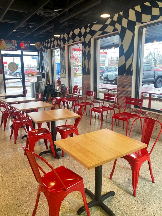 Industrial-chic meets comfort with those eye-catching red chairs. It's like sitting in a hot rod while contemplating your upcoming spice journey.