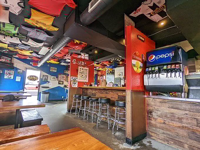 Colorful shirts hang from the ceiling like a Mary Poppins fever dream, creating the perfect whimsical atmosphere for serious fish consumption.