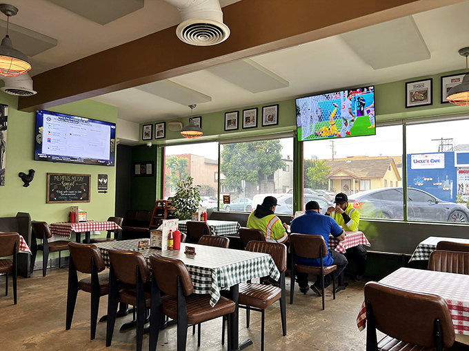 Classic red-and-white checkered tablecloths and green walls create that "grandma's kitchen" vibe where calories don't count and conversations flow as freely as the sweet tea.
