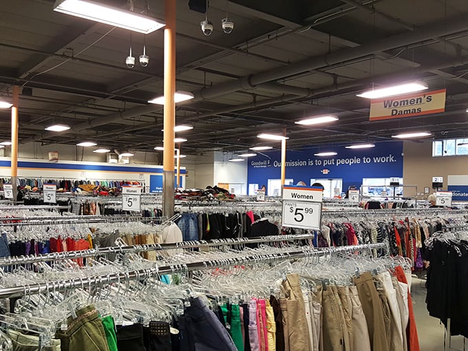 Organized chaos at its finest&mdash;rows upon rows of potential wardrobe upgrades await under the watchful gaze of fluorescent lighting.