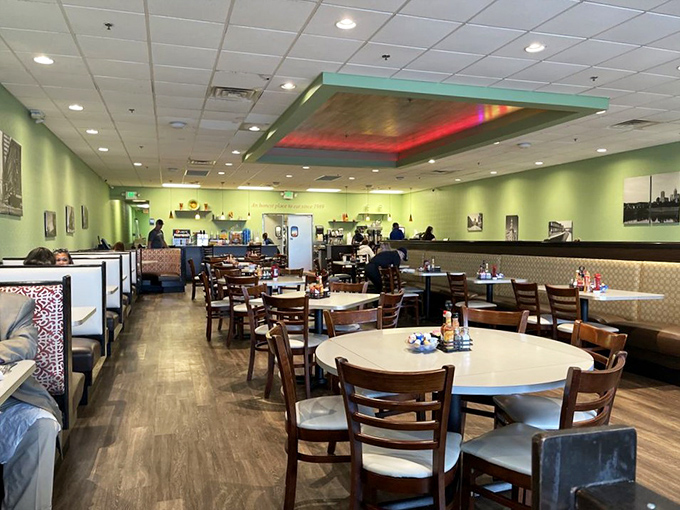 The dining room's mint green walls and warm wood create that perfect "grandma's kitchen meets modern diner" vibe where breakfast dreams come true.