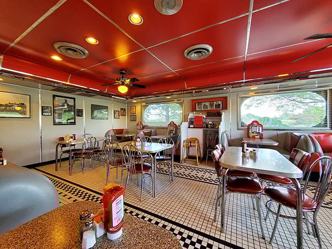 Red ceiling, chrome accents, and vintage booths create the perfect backdrop for comfort food memories in the making.
