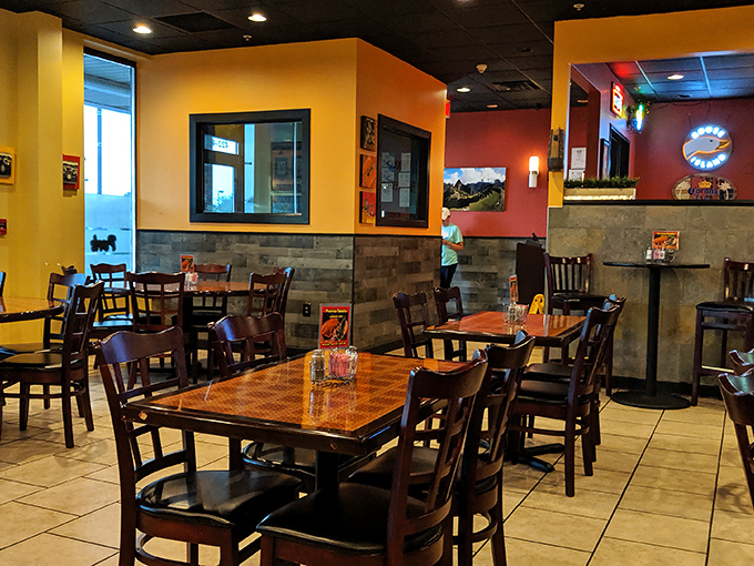 Warm yellow and red walls transport diners from Newark to Lima in an instant. Comfort meets authenticity in this cozy dining space.