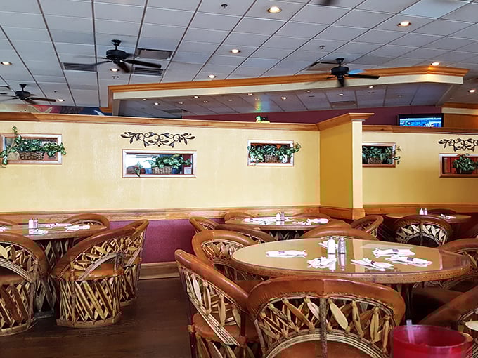 Warm yellow walls and those distinctive woven equipale chairs create an atmosphere that whispers "authentic" without shouting it&mdash;the perfect backdrop for flavor fireworks.