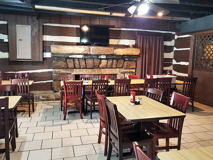 Inside, the stone fireplace and exposed log walls create the perfect backdrop for comfort food conversations. Rustic never tasted so right.