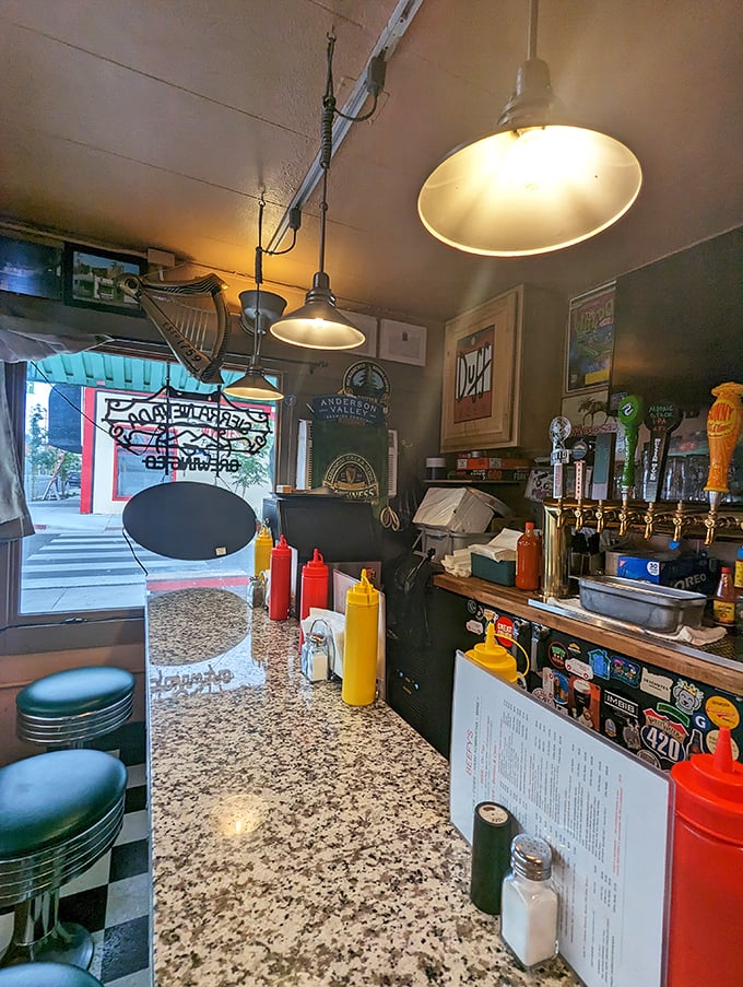 Inside, the no-frills counter service setup lets you watch the magic happen. Those condiment bottles stand ready for deployment like soldiers awaiting orders.