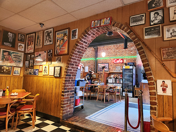 Step through the archway into burger paradise. The wood-paneled walls and vintage memorabilia create the perfect backdrop for serious comfort food consumption.