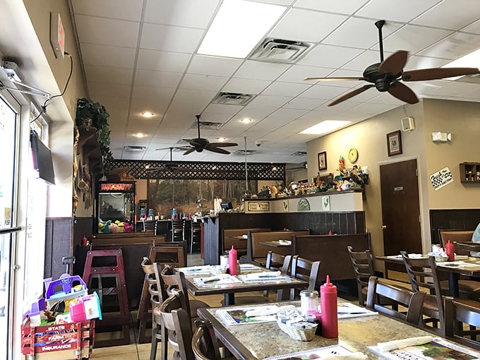 Step inside to a world where ceiling fans lazily spin above wooden tables, red ketchup bottles stand at attention, and comfort food reigns supreme.