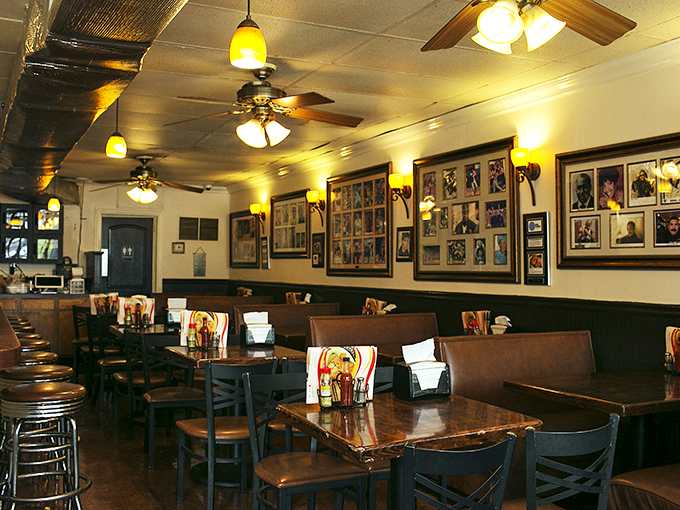 Where history meets comfort. The warm glow of pendant lights illuminates decades of memories on these walls, while ceiling fans lazily stir anticipation for what's about to arrive.