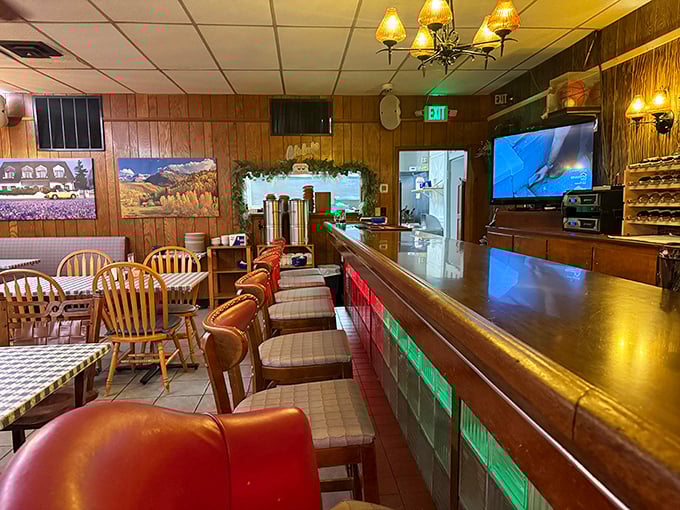 Step inside to wood-paneled nostalgia where checkered tablecloths and warm lighting promise comfort food that transcends trends.