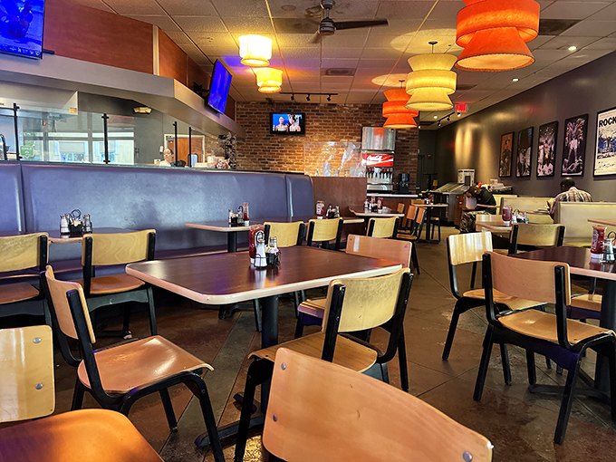 Orange pendant lamps cast a warm glow over wooden tables and blue booths. This isn't fancy dining&mdash;it's comfortable eating at its finest.