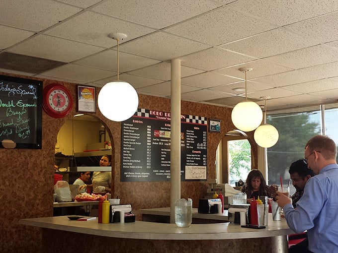 Inside, globe lights illuminate a counter where culinary magic happens. Time travel never tasted so delicious.
