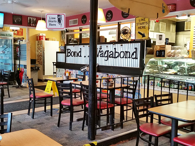 Where sandwich dreams begin. The "Line Starts Here" sign isn't just practical guidance&mdash;it's a promise of good things worth waiting for.