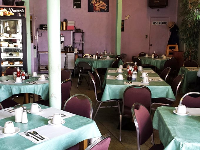 Mint green tablecloths and simple settings create that rare atmosphere where conversations flow as freely as the coffee refills.