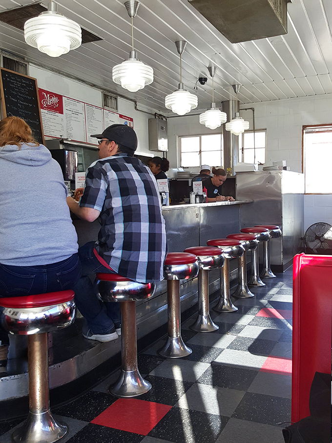 The classic counter seating isn't just nostalgic&mdash;it's front-row tickets to the greatest show on earth: watching your burger journey from grill to glory.