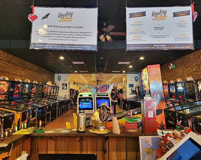 Overhead signs promise to "save your quarters at home" while patrons of all ages indulge in the timeless joy of analog gaming beneath exposed brick walls.
