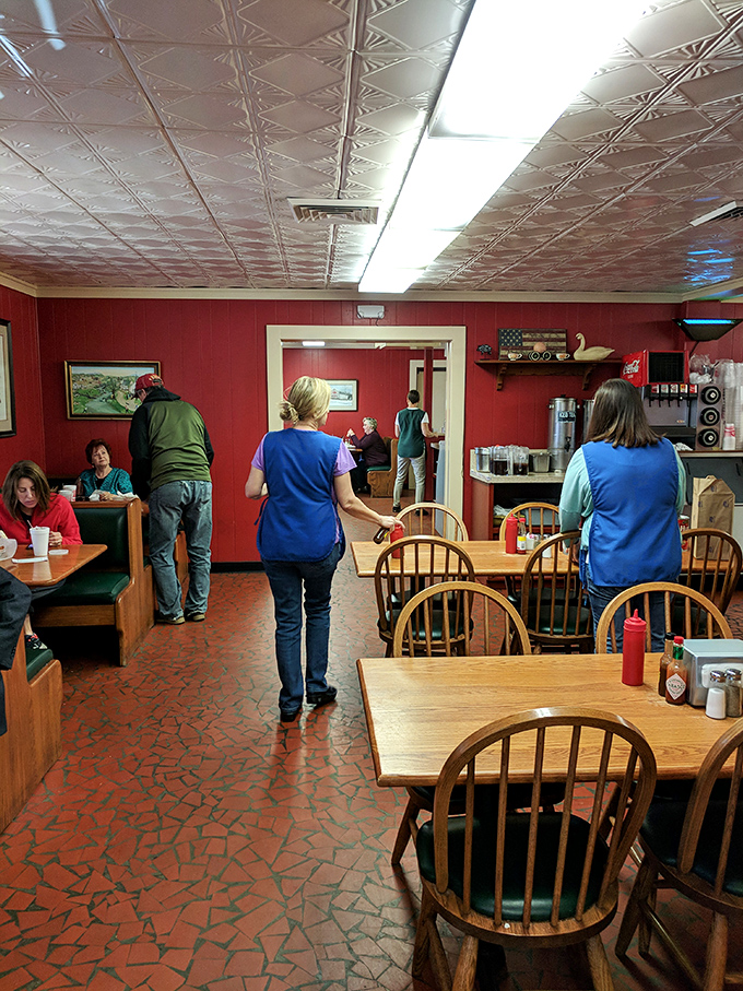 Inside, pressed tin ceilings watch over wooden chairs that have supported generations of barbecue enthusiasts. No designer lighting needed&mdash;just pure authenticity.