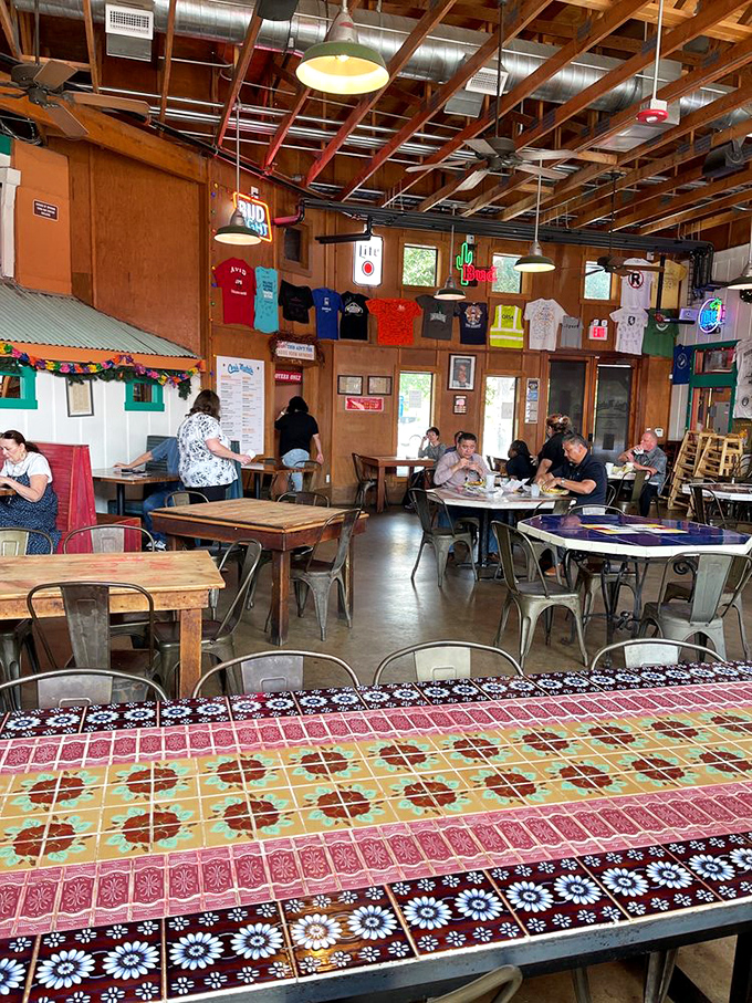 Exposed wooden beams, colorful tile tables, and walls adorned with local memorabilia create the perfect unpretentious atmosphere for serious burger business.