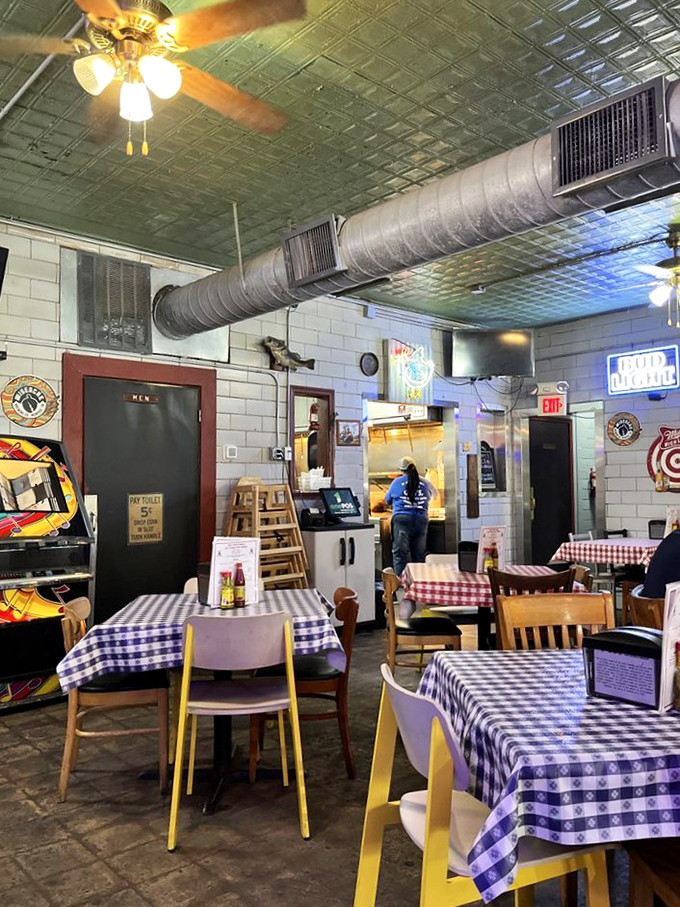 Checkered tablecloths, ceiling fans, and exposed ductwork create that perfect "no-frills" atmosphere where you know the focus is squarely on the food.