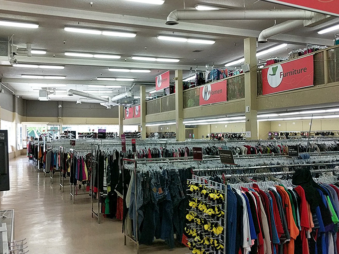 Endless racks stretch toward the horizon in this thrifter's paradise. The Narnia of pre-loved fashion awaits beyond those fluorescent lights.