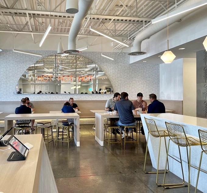 Clean lines, geometric patterns, and stylish seating create the perfect backdrop for the main event: that glorious, glorious chicken.