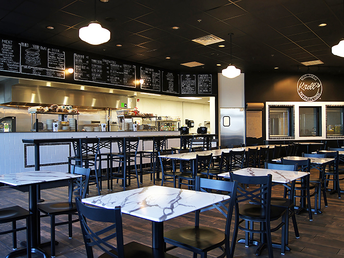 Clean lines, marble tables, and that glorious menu board &ndash; this isn't just a restaurant, it's a temple of sandwich worship.