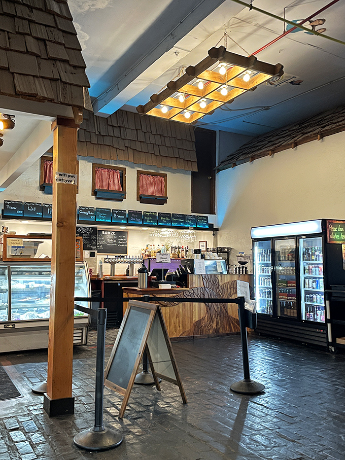 Step inside and the deli's rustic charm immediately envelops you &ndash; wooden shingles, checkered curtains, and that unmistakable aroma of sandwiches being crafted with care.