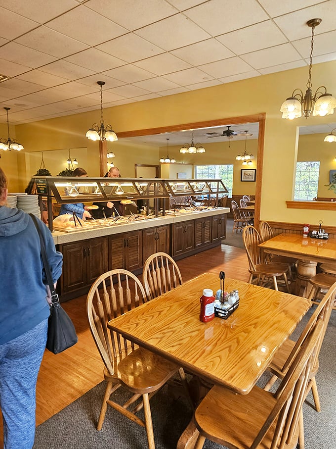 Inside, warm yellow walls and Windsor-back chairs create that "grandma's dining room" feeling. The buffet stretches invitingly across the room, promising multiple return trips.