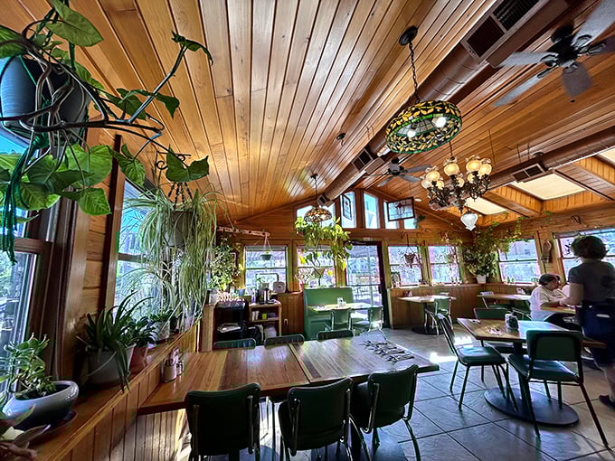 Wooden ceiling beams, hanging plants, and Tiffany-style lamps create the perfect diner atmosphere&mdash;like eating in your coolest aunt's sunroom.