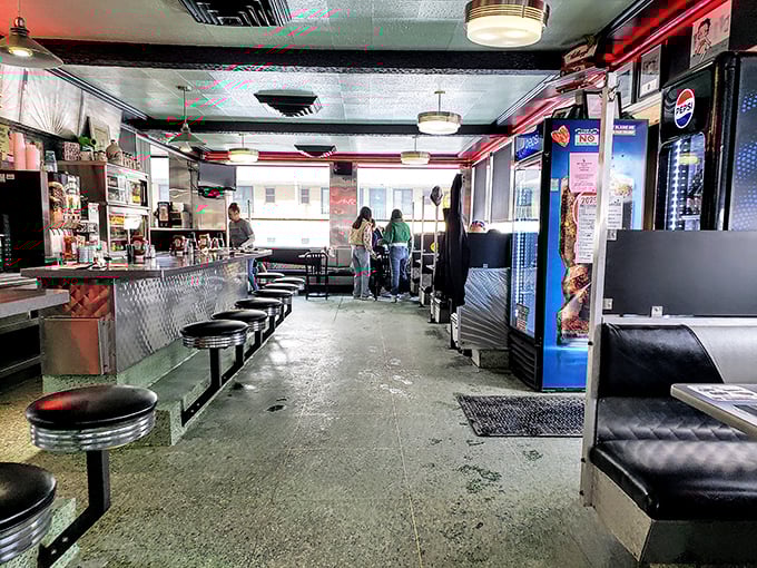 The counter where breakfast dreams come true. Those stools have supported more satisfied customers than a therapist's couch.