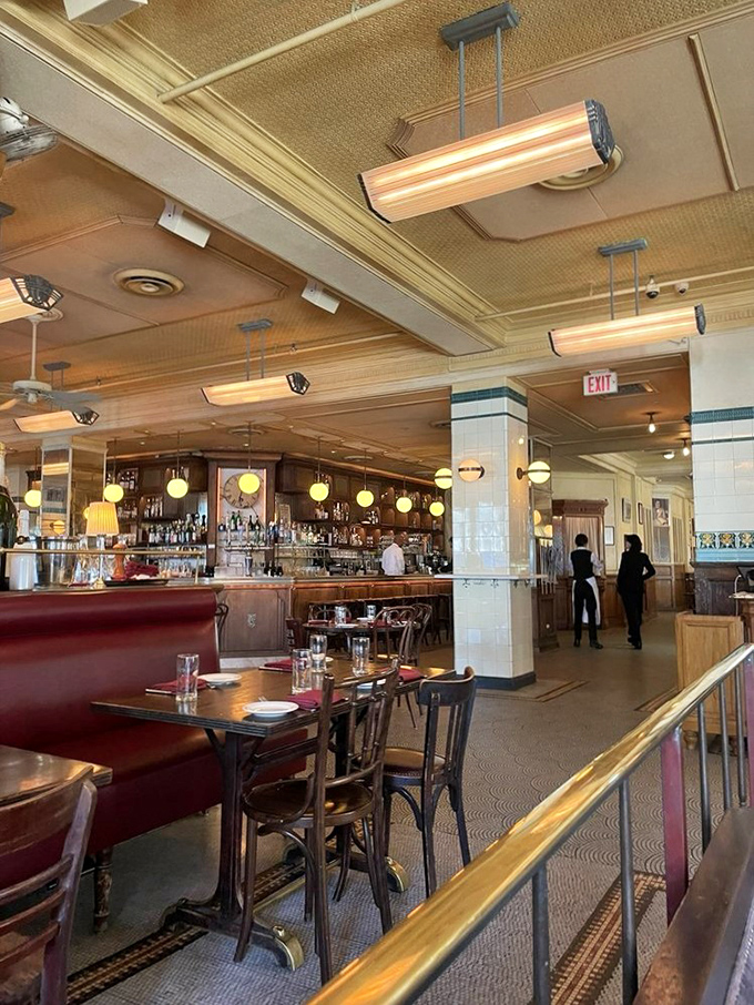 Inside Parc, the warm glow of pendant lights, rich wood paneling, and red leather banquettes create the perfect backdrop for your Parisian daydreams.