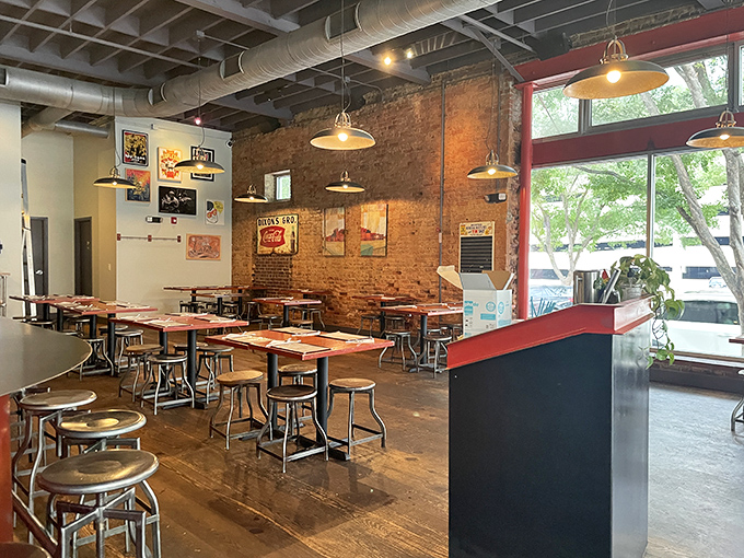 Industrial-chic meets Southern comfort in this airy space. Exposed brick, pendant lighting, and communal tables create the perfect backdrop for chicken-induced happiness.