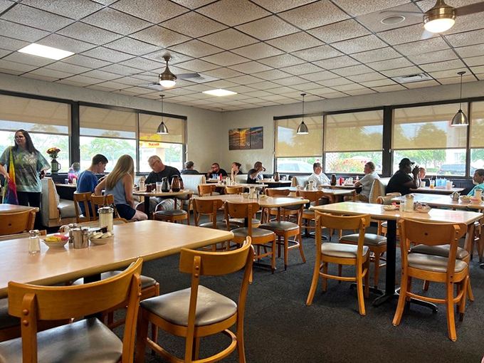 Morning magic happens here, where wooden chairs and natural light create the perfect backdrop for life-changing breakfast decisions.
