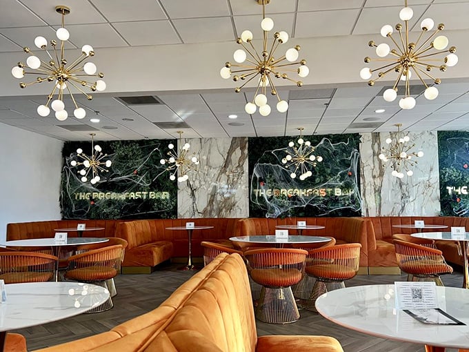 Those starburst chandeliers aren't just lighting fixtures; they're the opening act for breakfast theater at its finest.