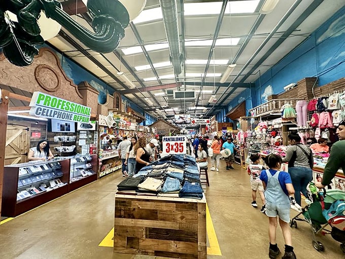 Denim paradise meets cellphone repair in this bustling main corridor. Like a mall designed by people who actually understand what shoppers want&mdash;variety, value, and vibrant energy.