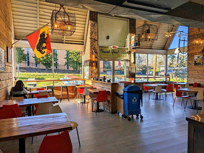 Inside, fishing baskets transformed into light fixtures hang above colorful chairs and wooden tables. Maritime-meets-modern in the most unpretentious way possible.