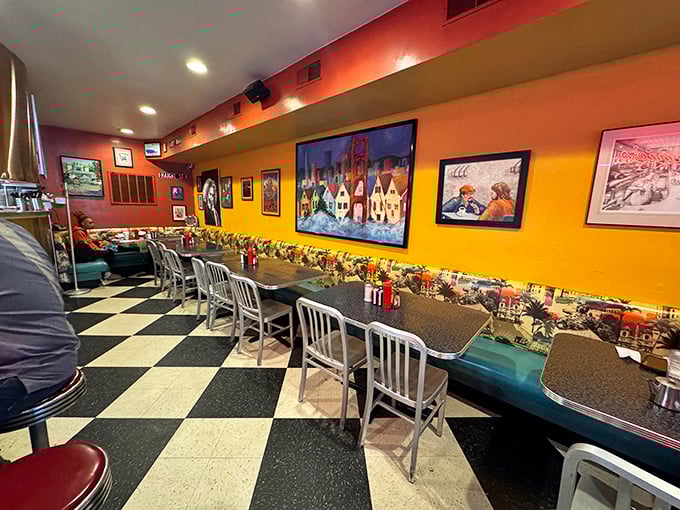 Inside, the classic diner aesthetic shines with checkered floors and warm-toned walls adorned with local art&mdash;comfort personified.
