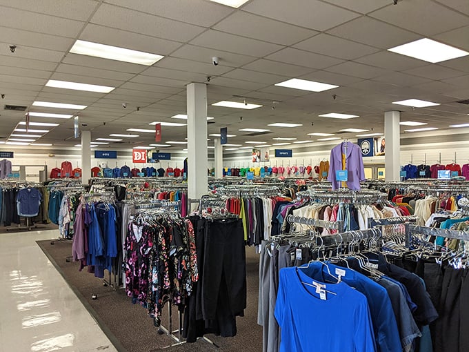 A sea of clothing racks stretches toward the horizon, each hanger a possibility, each aisle an adventure waiting to unfold.