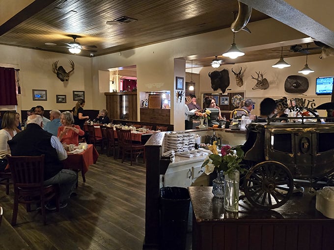 Step inside and time stands still&mdash;mounted trophies watch over diners while the warm wood paneling creates the perfect steakhouse atmosphere.